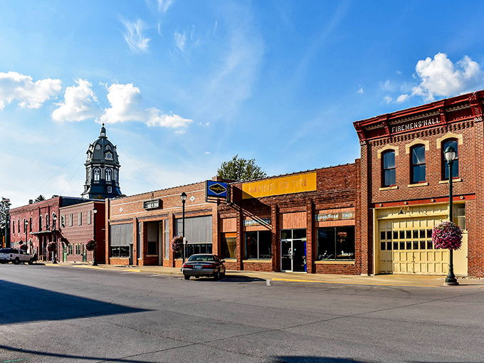 Winterset's historic downtown showcases classic Americana architecture, where the courthouse clock tower stands sentinel over brick buildings that have witnessed generations of small-town stories.