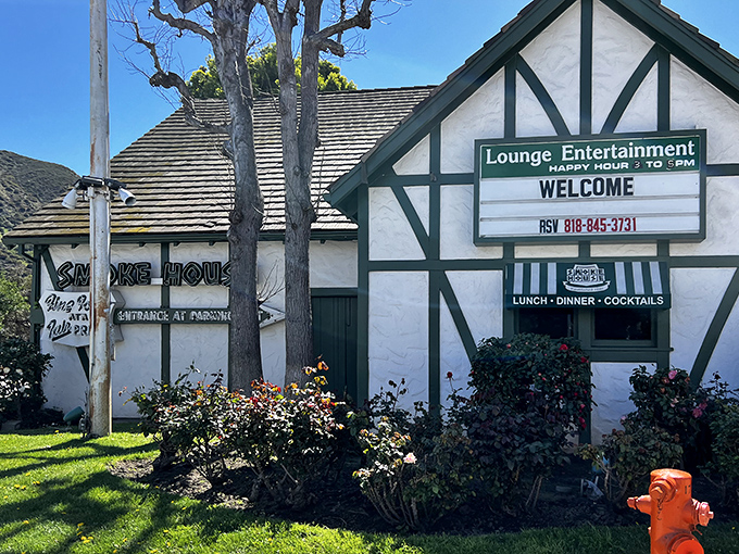 The Tudor-style exterior of Smoke House Restaurant stands as a charming time capsule amid Burbank's modern landscape, welcoming diners with old-school hospitality.