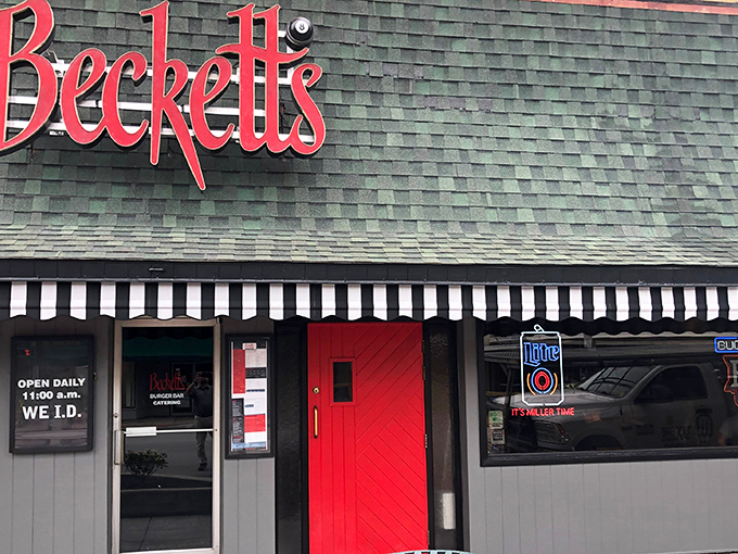 The classic brick fa&ccedil;ade of Beckett's welcomes hungry visitors with its distinctive green awning and glowing red sign &ndash; a beacon for burger enthusiasts in downtown Bowling Green.