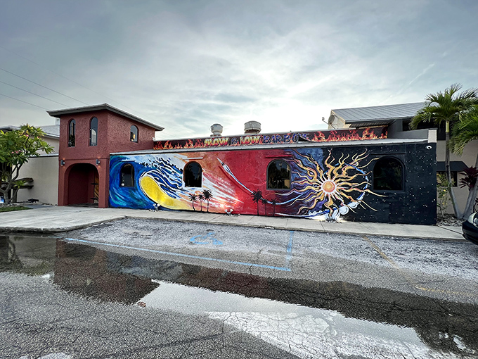 The surf meets smoke at Slow & Low's eye-catching exterior, where vibrant waves and flames dance across the building like a BBQ fever dream.