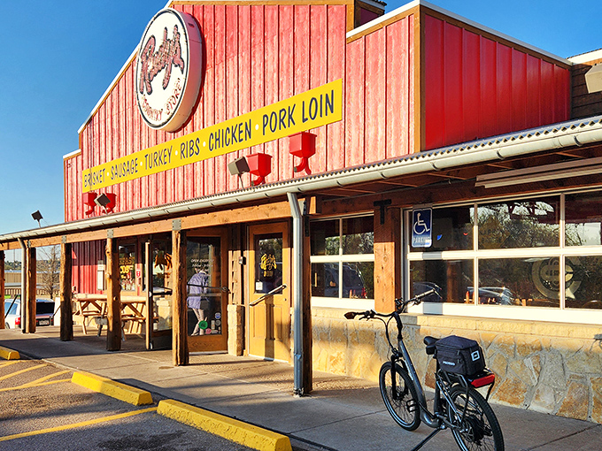 Rudy's iconic red exterior glows like a beacon at dusk, promising carnivorous delights that have made pilgrims out of ordinary diners.