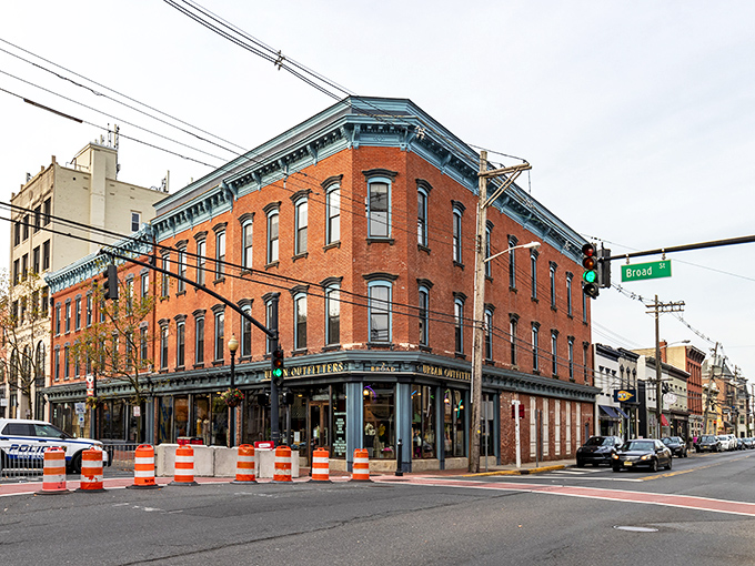 Historic brick buildings with distinctive blue trim line Broad Street, where Red Bank's architectural character shines through even on a cloudy day.