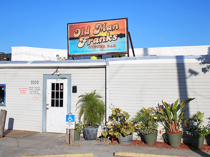 Like a maritime treasure map, Old Man Frank's colorful sign promises adventure for your taste buds in Winter Haven's hidden culinary waters.