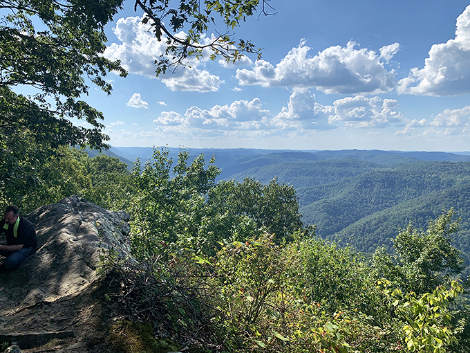 Nature's own IMAX theater unfolds before you at Kingdom Come's signature overlook. The rolling Appalachian mountains stretch to infinity, making your problems seem delightfully insignificant.