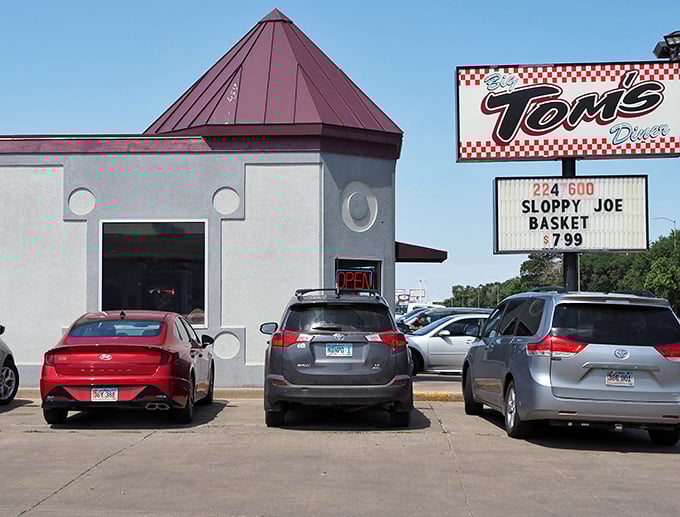 Big Tom's distinctive burgundy roof and checkerboard signage stand as a beacon for hungry travelers in Pierre.