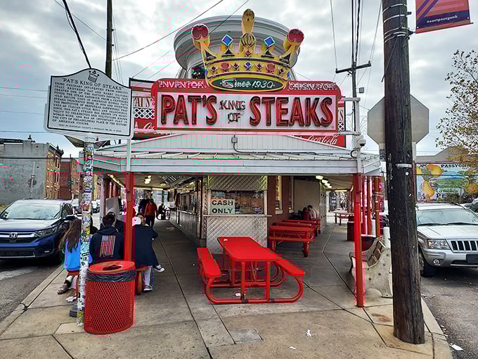 The iconic crown-topped sign at Pat's King of Steaks isn't just neon braggadocio—it's a legitimate claim to Philadelphia royalty that's been earned one cheesesteak at a time.