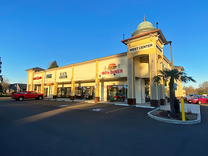The golden dome of 60's Caf&eacute; & Diner stands like a retro beacon in Tualatin, promising nostalgic flavors and vinyl-booth comfort beneath Oregon skies.