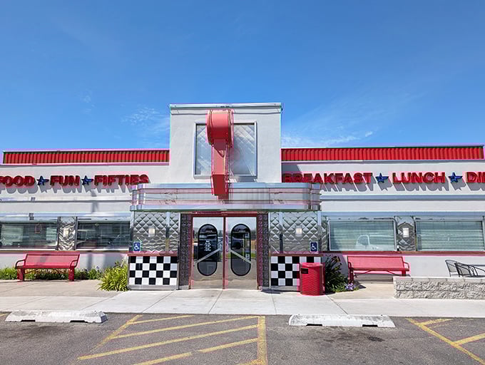 The gleaming chrome exterior of Dixie's Diner shines like a beacon of nostalgia, promising "FOOD ★ FUN ★ FIFTIES" under the bright Idaho sky.