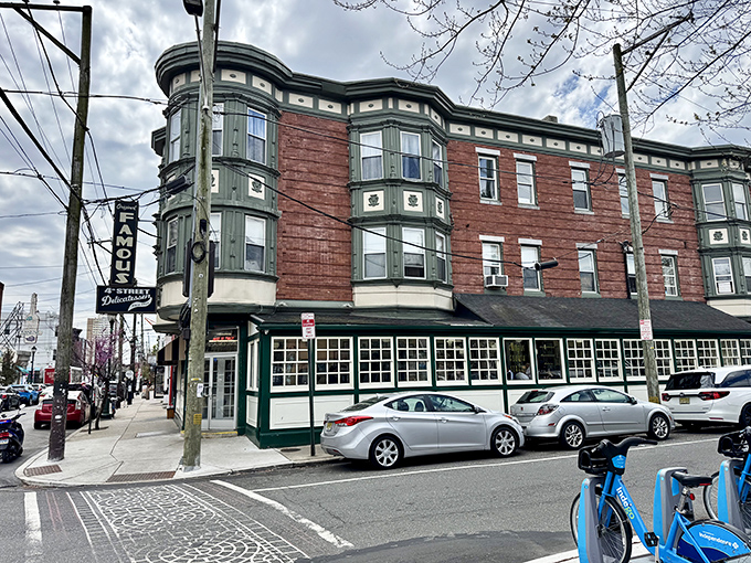 The iconic corner building stands proudly at 4th and Bainbridge, its vintage sign promising delicatessen delights that have satisfied Philadelphians for generations.