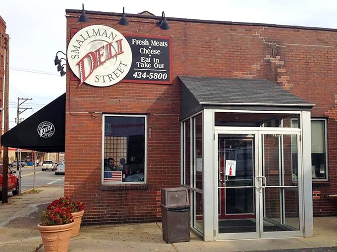 The brick fortress of flavor stands proud in Pittsburgh's Strip District, its circular sign a beacon for sandwich seekers everywhere.