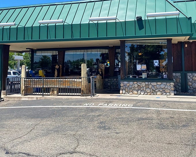 The iconic green-roofed exterior of Black Bear Diner stands like a woodland lodge that somehow wandered into Redding and decided to stay put.