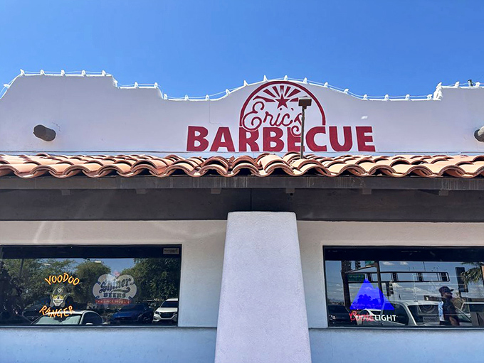 That distinctive white exterior with terracotta tiles and bold red signage promises serious barbecue awaits inside.
