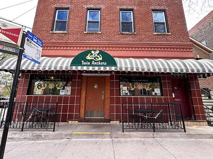 That iconic red brick exterior with striped awning isn't shouting for attention—it's confident enough to whisper, "The best ribs in Chicago are right through this door."