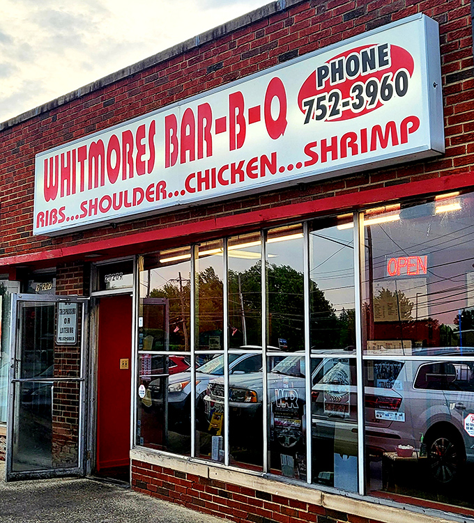 The iconic red and white sign beckons like a barbecue lighthouse. No fancy frills needed when what's inside smells this good.