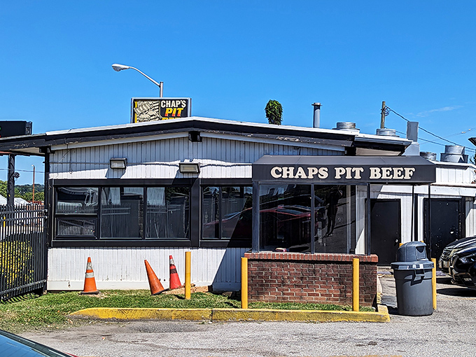The unassuming exterior of Chaps Pit Beef stands like a meat-smoking fortress in Baltimore, promising carnivorous delights within its humble walls.