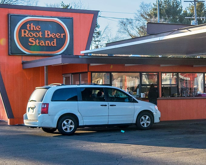 The iconic orange exterior of The Root Beer Stand stands as a beacon of nostalgia on Westnedge Avenue, drawing root beer pilgrims from across Michigan.