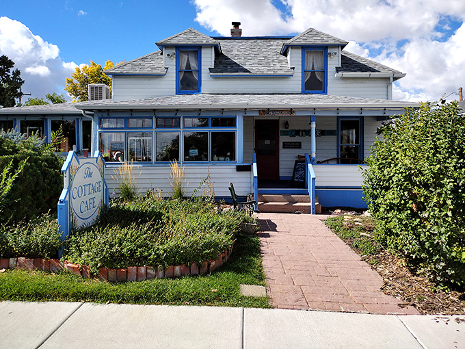 The storybook charm of this blue-trimmed cottage isn't false advertising—inside awaits sandwich magic that would make any bread enthusiast weak at the knees.