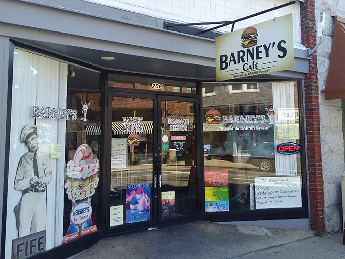 The unassuming storefront of Barney's Cafe beckons with nostalgic charm, promising burgers that might just change your definition of perfection.