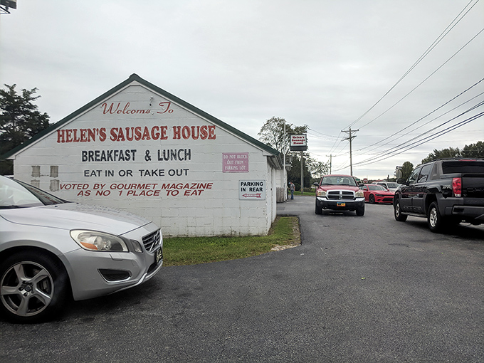 The modest white exterior of Helen&rsquo;s Sausage House stands as a breakfast beacon along Route 13, inviting hungry travelers to discover the delicious treasures inside.