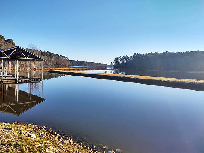 Mirror-like waters reflect the sky's brilliance at White Oak Lake, where even the fish pause to admire their own good looks.