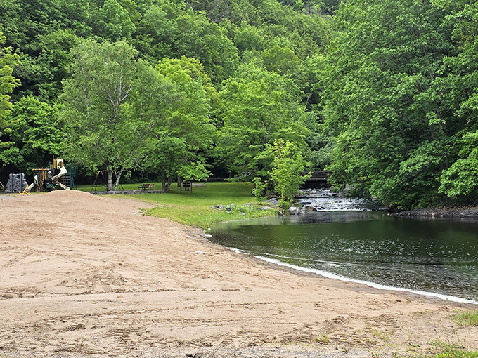 A hidden beach oasis nestled among the trees. Mother Nature's swimming pool comes complete with a sandy shore and refreshing waters.