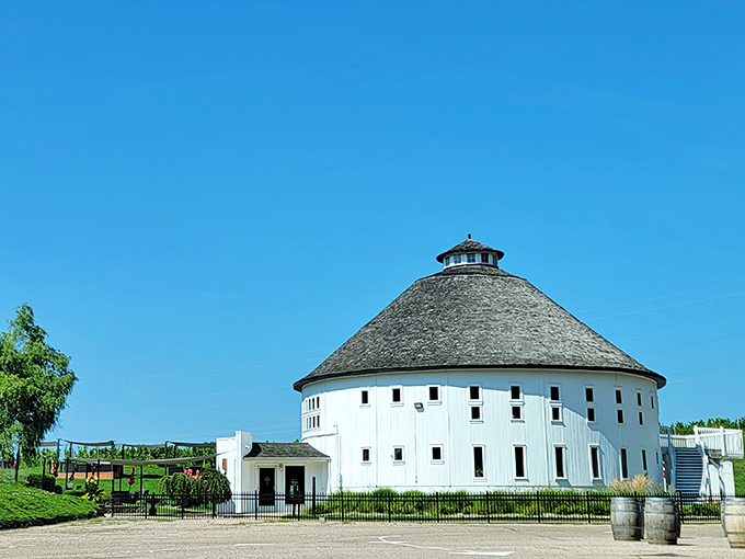 Michigan's answer to Tuscany rises against a perfect blue sky, proving you don't need a passport for world-class wine country vibes.