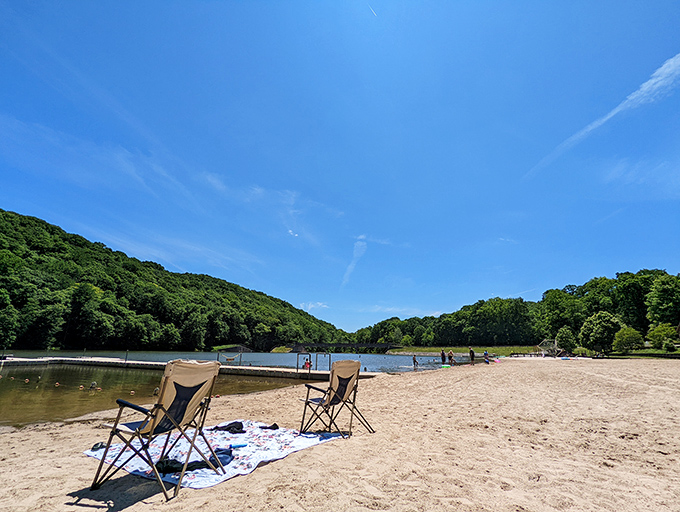 Nothing says summer bliss like this&mdash;two chairs, soft sand, and a lake so calm it practically hums relaxation.