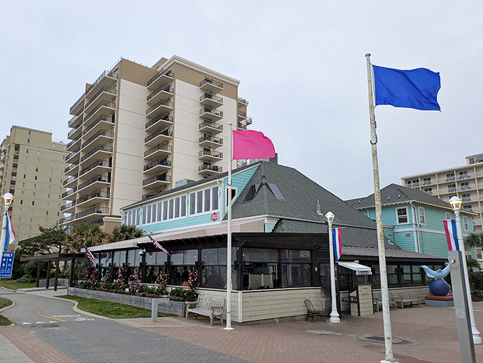 The distinctive aqua-blue exterior of Waterman's stands out like a beachside beacon, promising seafood treasures within its coastal-chic walls.