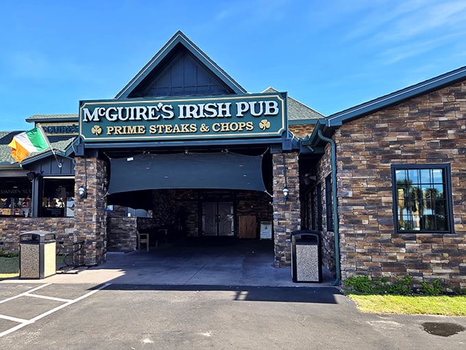 The stone facade of McGuire's Irish Pub stands like an emerald beacon amid Panama City Beach's sun-soaked landscape, promising Celtic comfort far from Ireland's shores.