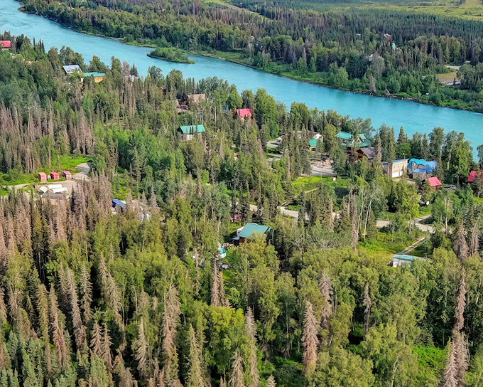 Aerial paradise where turquoise waters meet emerald forests &ndash; Soldotna's riverside cabins offer front-row seats to Alaska's greatest show on earth.