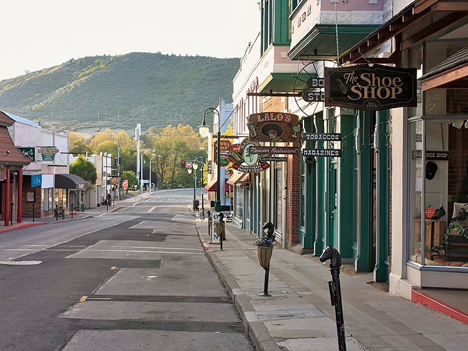 Miner Street's storefronts stand like sentinels of simpler times, where shopping doesn't require a second mortgage and mountains keep watch over commerce.