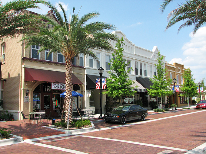 The golden-hued storefronts of Eustis's main street stand like sentinels of simpler times, inviting visitors to explore at a leisurely pace.