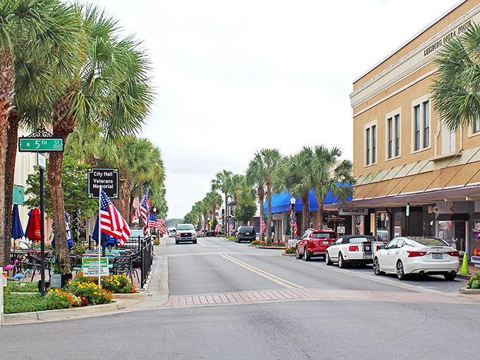 Main Street Leesburg offers that perfect blend of small-town charm and modern convenience, where American flags flutter alongside palm trees in a quintessentially Florida tableau.