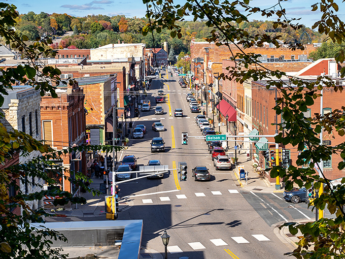 Downtown Stillwater unfolds like a storybook from above, with its neat grid of historic buildings framed by autumn-kissed hills and the St. Croix River.