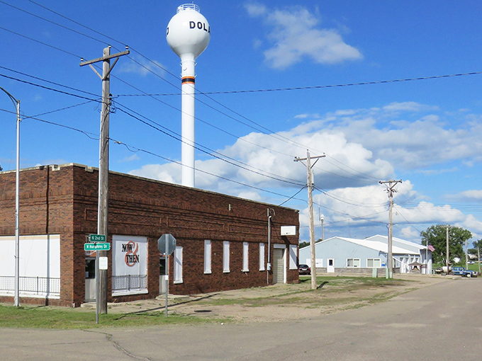 Small-town charm meets big sky country at this intersection, where the water tower stands sentinel over Redfield's quiet streets.