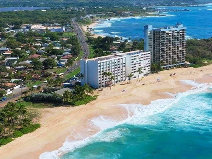 Farrington Highway hugs the coastline like an old friend, revealing Waianae's stunning shoreline where high-rises give way to paradise.