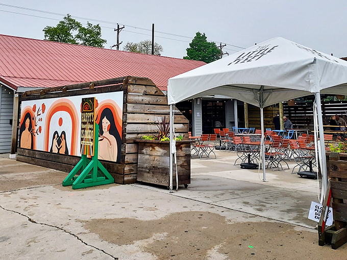 Colorful murals and casual seating create an inviting atmosphere that says, "Stay awhile, the food's worth it!" Pure Michigan hospitality meets artistic expression.