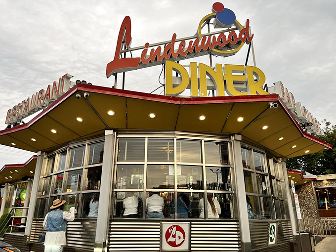 That classic red-and-yellow sign doesn&rsquo;t just mark a diner&mdash;it heralds a Brooklyn institution where hunger waves the white flag and calories cease to matter.