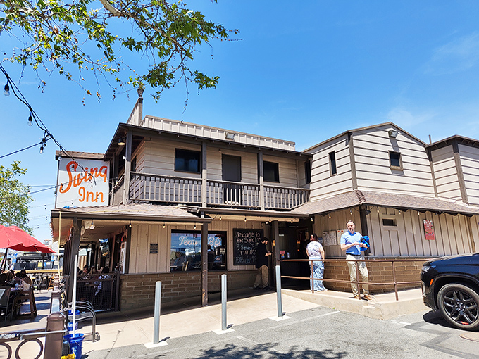 The Western-style facade of Swing Inn Cafe stands proudly in Old Town Temecula, promising comfort food that's been satisfying hungry patrons since 1927.