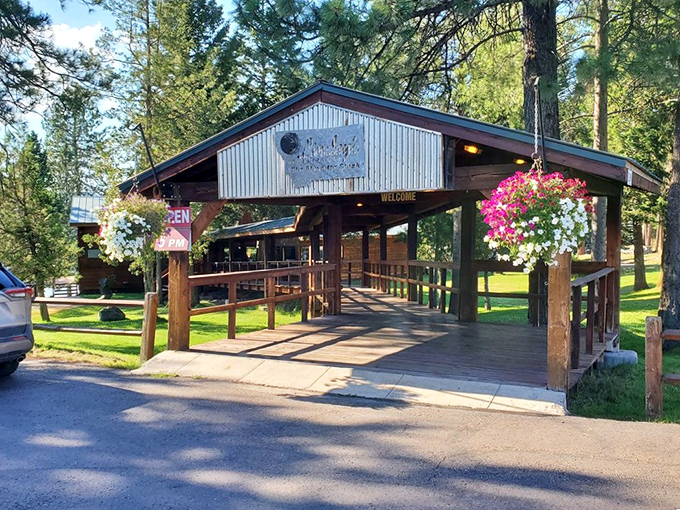Welcome to meat paradise! Lindey's rustic entrance, adorned with colorful hanging flower baskets, promises a Montana steakhouse experience worth every mile of the journey.