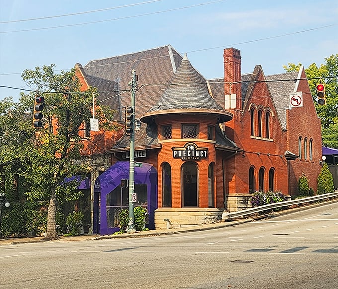 The historic brick fortress of flavor stands proudly on the corner, its purple awnings and turret announcing: "Serious steak business happens here."