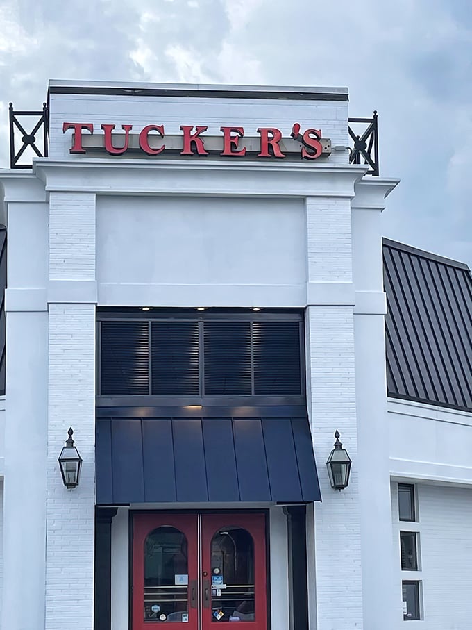 Tucker's bold red signage against crisp white architecture makes a promise your taste buds will thank you for keeping.