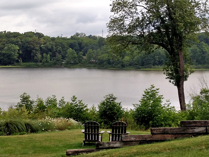 Two Adirondack chairs facing the serene waters of Punderson Lake &ndash; nature's version of front-row seats to the best show in Ohio.