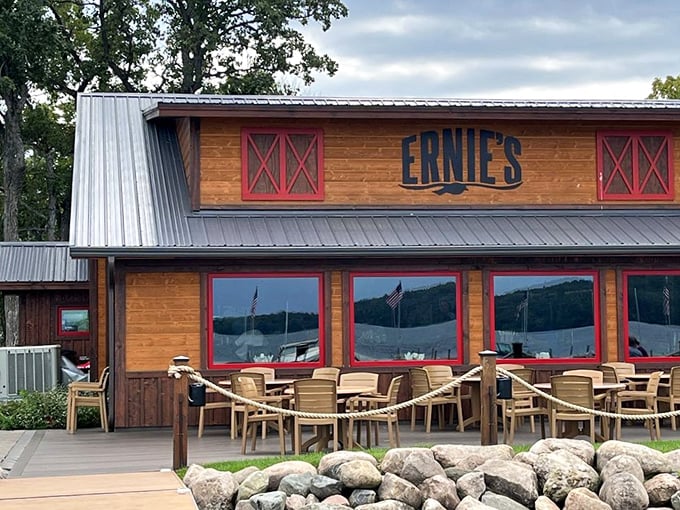 Ernie's rustic wooden exterior with its bold red trim stands like a welcoming beacon for hungry lake-goers.