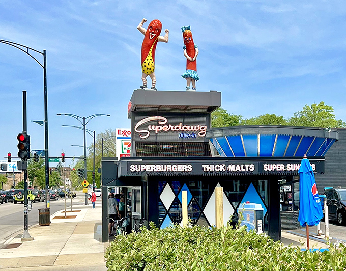 Those iconic hot dog mascots have been waving hello since the Eisenhower era, standing guard over Milwaukee and Devon like culinary sentinels in swimwear.