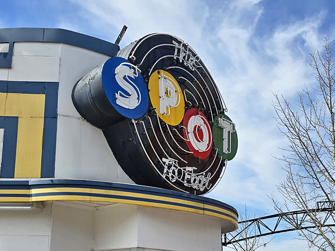 The iconic neon sign of The Spot Restaurant glows like a beacon of hope for hungry travelers. Art Deco styling meets small-town charm in this Sidney landmark.