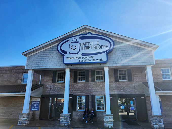 The welcoming facade of Hartville Thrift Shoppe promises treasure hunting adventures behind those doors. "Every purchase is a gift to the world" isn't just clever marketing&mdash;it's their mission.