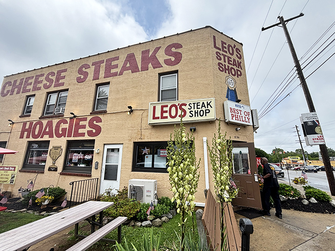 The sandwich promised land announces itself with no-frills confidence. Leo's bold lettering on tan brick says everything you need to know: serious hoagies happen here.