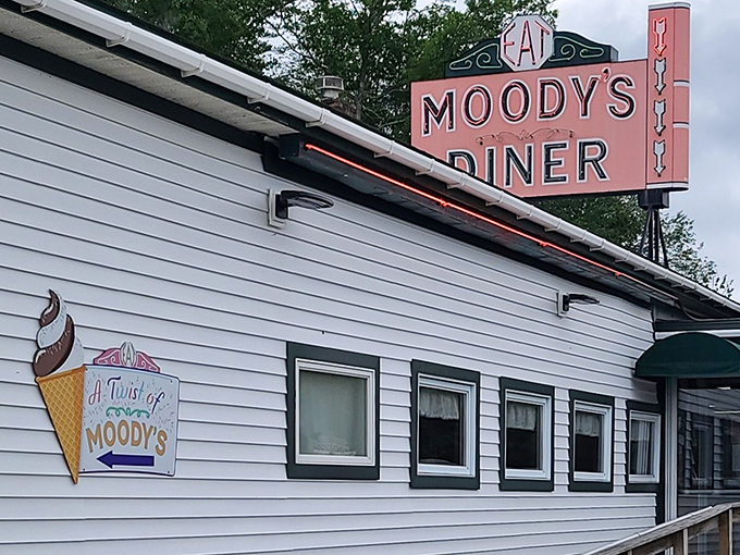 The iconic pink sign beckons hungry travelers like a neon lighthouse on Maine's coastal highway &ndash; a promise of comfort food that never disappoints.