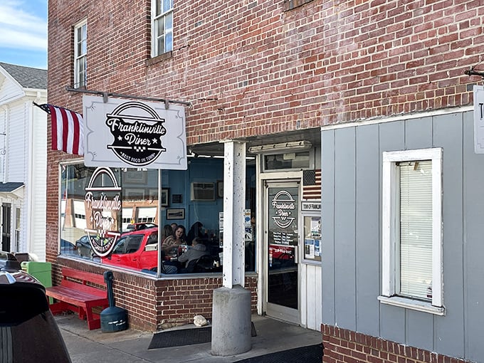 Small-town charm meets serious sandwich craftsmanship behind this unassuming storefront. The blue-gray siding and classic diner signage aren't putting on airs&mdash;they're saving all the drama for your taste buds.